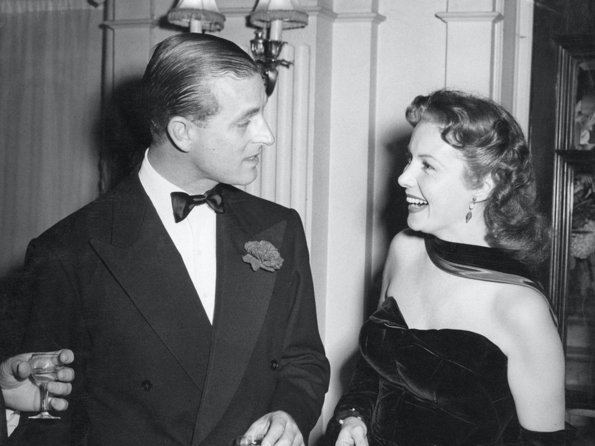 Here he is Above with American actress Rhonda Fleming