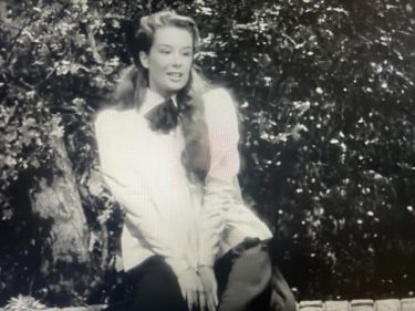 This teenage girl sees him from her vantage point sitting on the ...